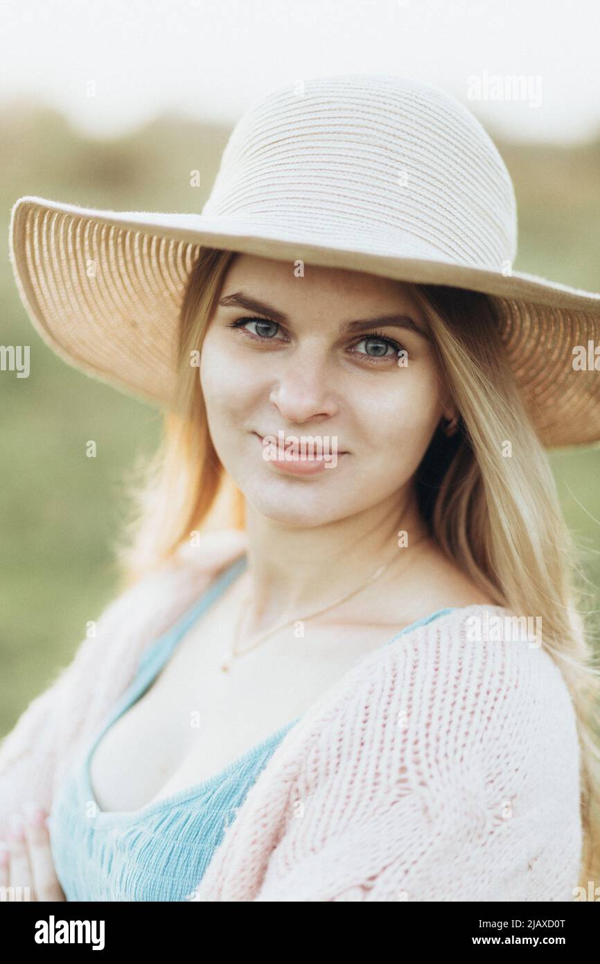 woman in jacket and hat enjoys the sunset alone Stock Photo - Alamy