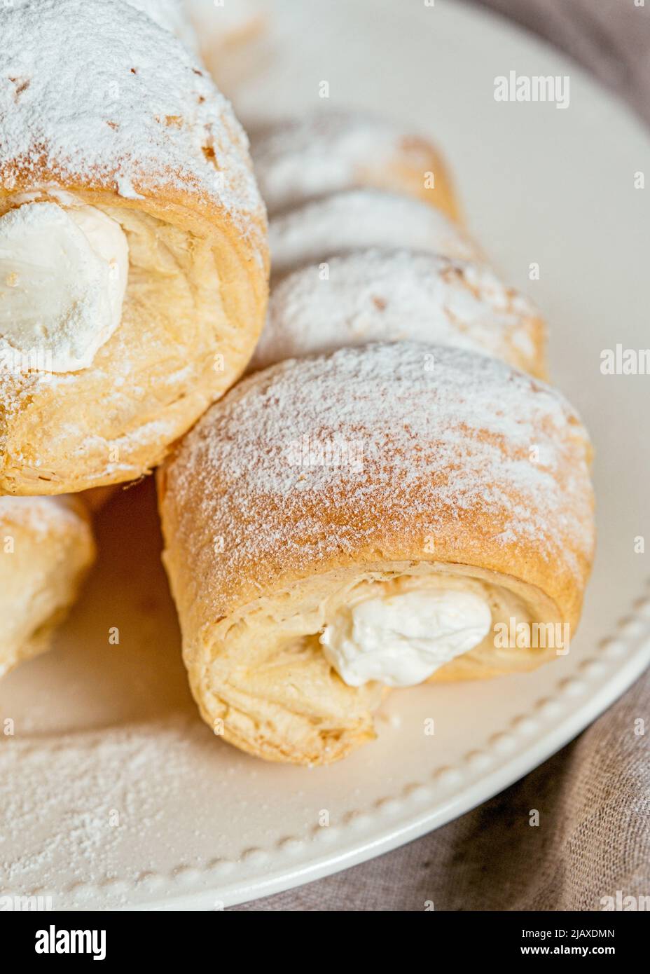 Puff cone with egg white cream Stock Photo - Alamy