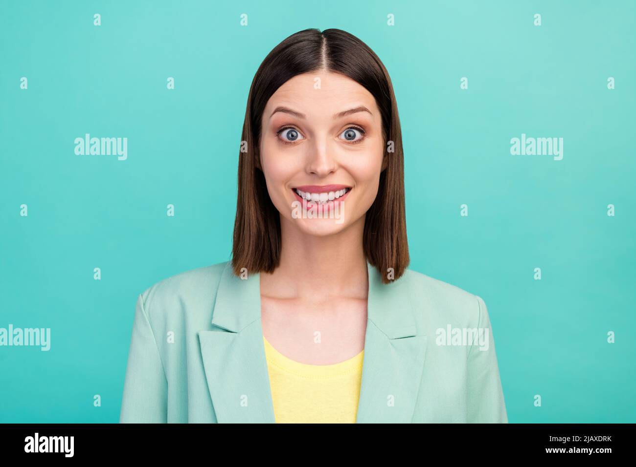 Photo of impressed young brunette lady wear blazer isolated on cyan ...