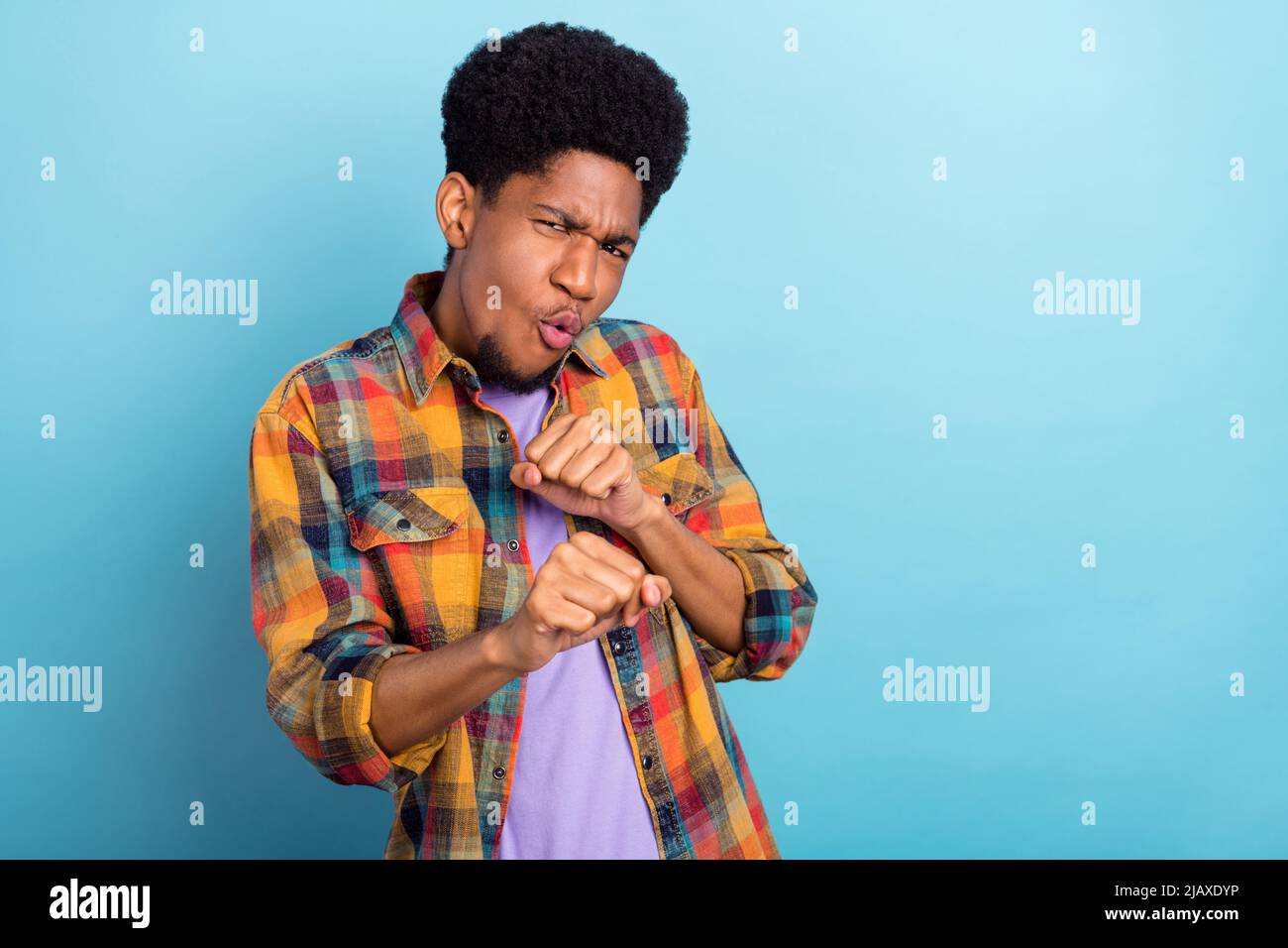 Photo of lovely young brunet guy dance wear checkered shirt isolated on ...