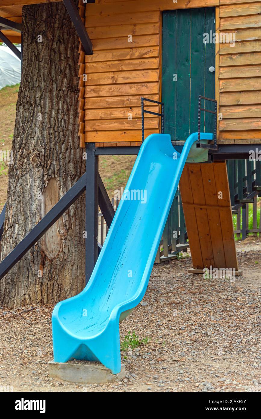 Blue Slide Children Playground Fun at Tree House for Kids Stock Photo ...