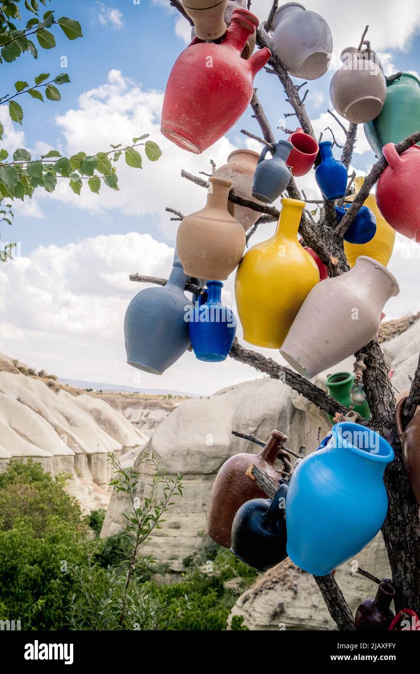 Ceramic vases on tree branch Stock Photo - Alamy