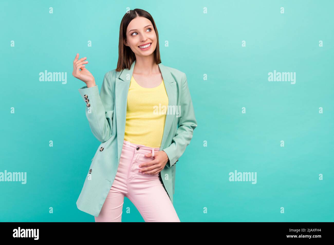 Photo of pretty positive girl look interested empty space toothy smile ...
