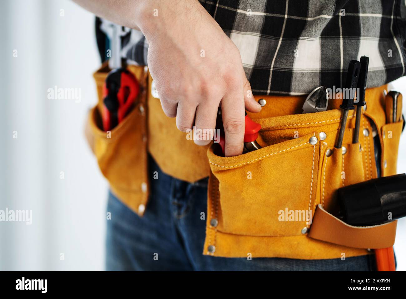Tool kit in repairman's mounting belt Stock Photo - Alamy