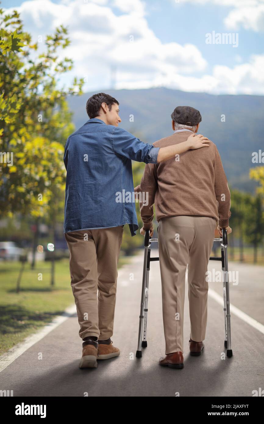 Young person helping elderly hi-res stock photography and images - Alamy