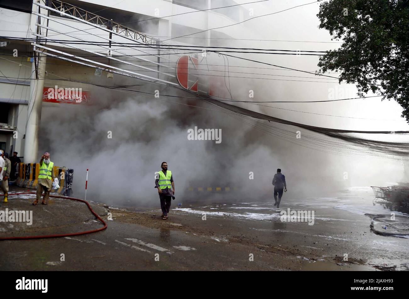 rising from a warehouse of the department store as the fire brigade ...