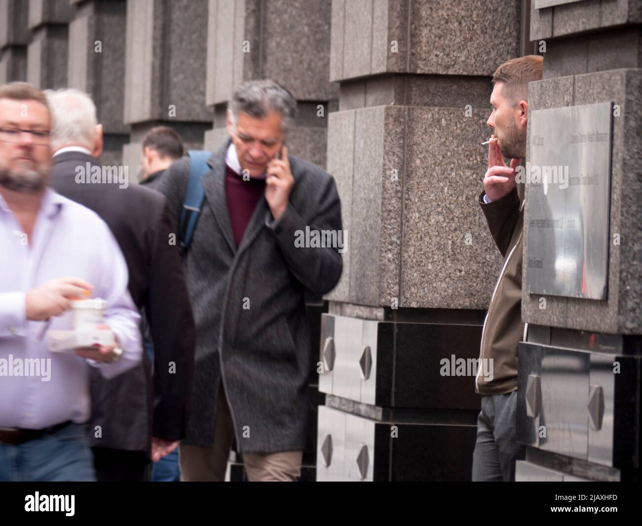 Smoker, smoking outside office in Central London Stock Photo - Alamy
