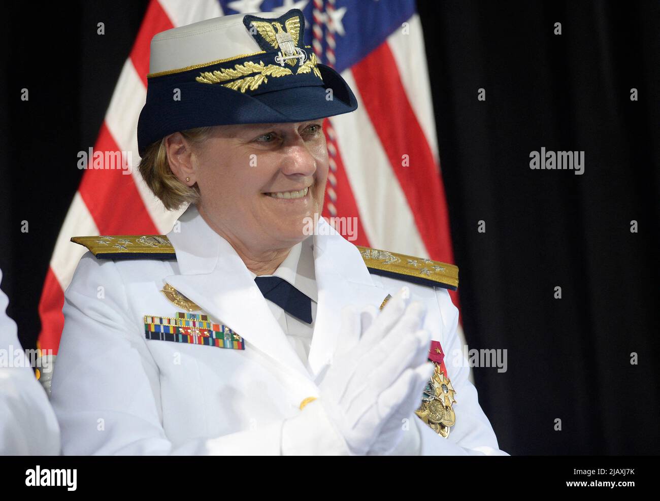 U.S. Coast Guard Adm. Linda Fagan applauds as President Joe Biden ...