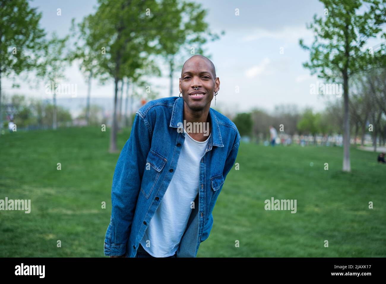 Portrait of young man with distinctive features in the park Stock Photo ...