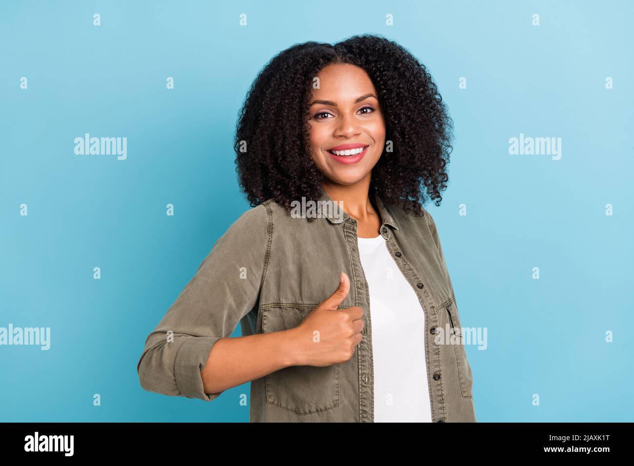 Portrait of gorgeous positive person beaming smile show thumb up look ...