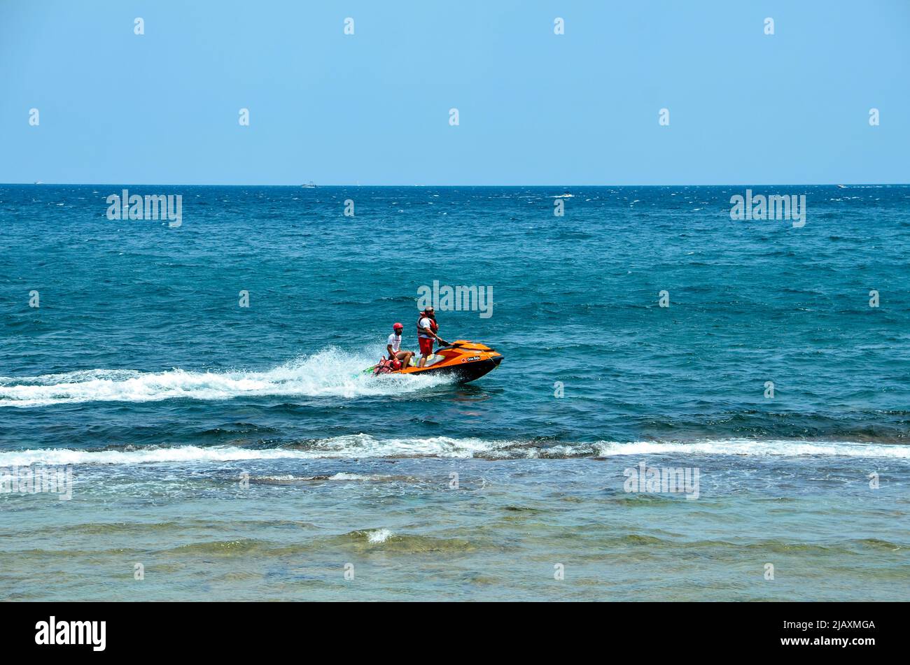 Denia, Alicante, Spain - July 20 2021: Two lifeguards are riding an ...