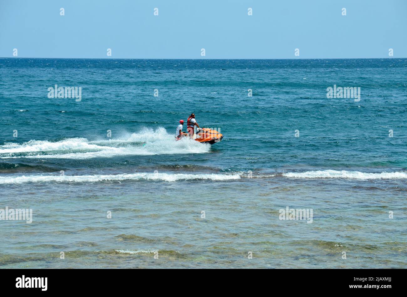 Denia, Alicante, Spain - July 20 2021: Two lifeguards are riding an ...