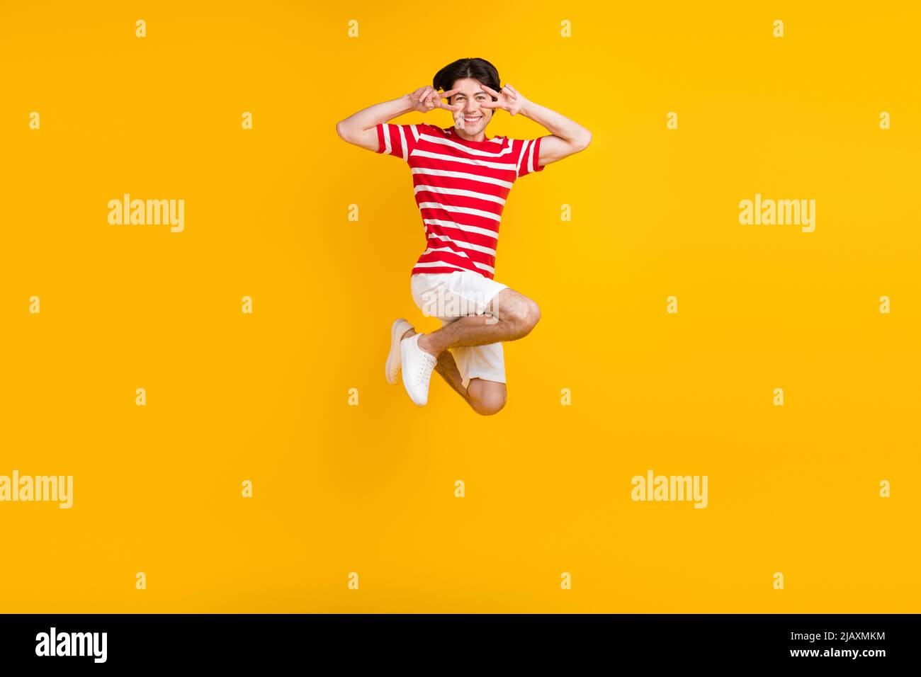 Full size photo of happy positive young make v-signs jump up good mood ...