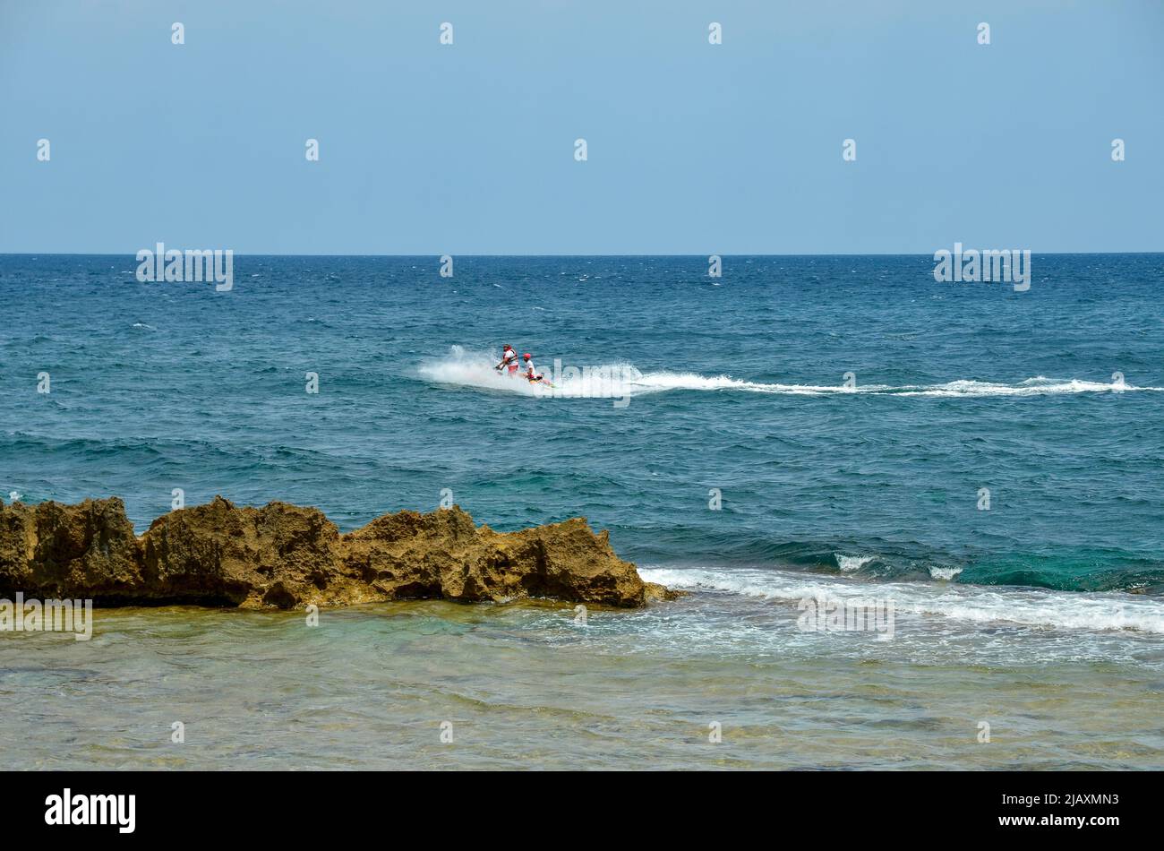 Denia, Alicante, Spain - July 20 2021: Two lifeguards are riding an ...