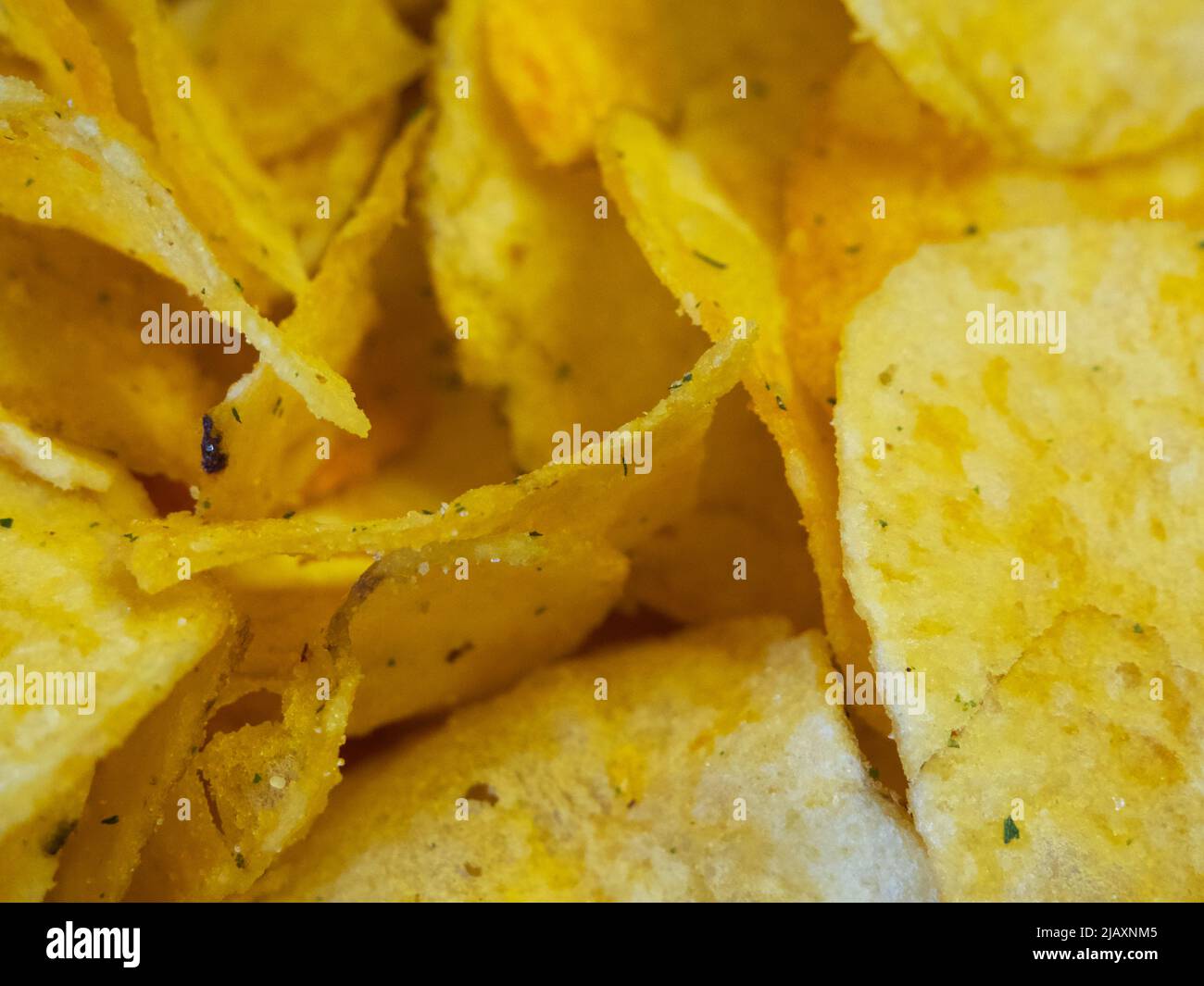Spiced potato chips, a close-up shot. Fried potatoes Stock Photo - Alamy