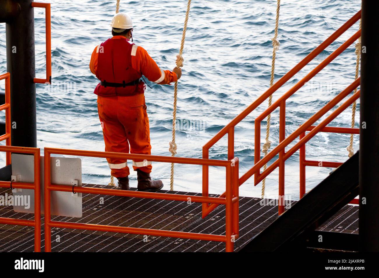 Rig workers are transported on a vessel to offshore rigs in The South ...