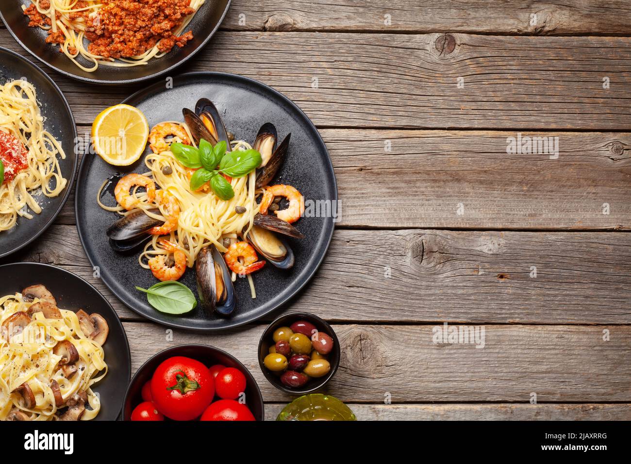 Various Italian pasta. Seafood, mushroom and tomato sauce pasta ...