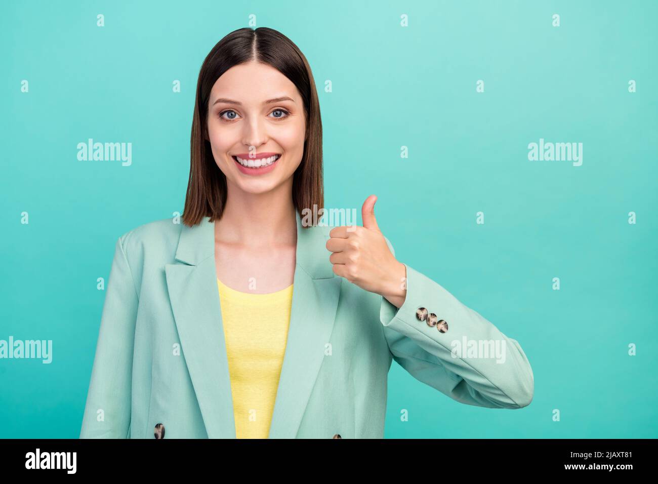 Photo Of Optimistic Young Brunette Lady Show Thumb Up Wear Blazer