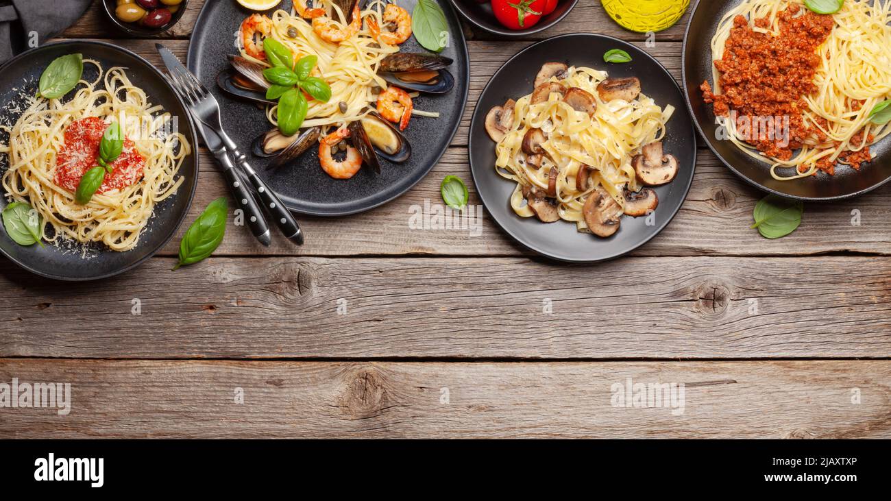 Various Italian pasta. Seafood, mushroom and tomato sauce pasta ...
