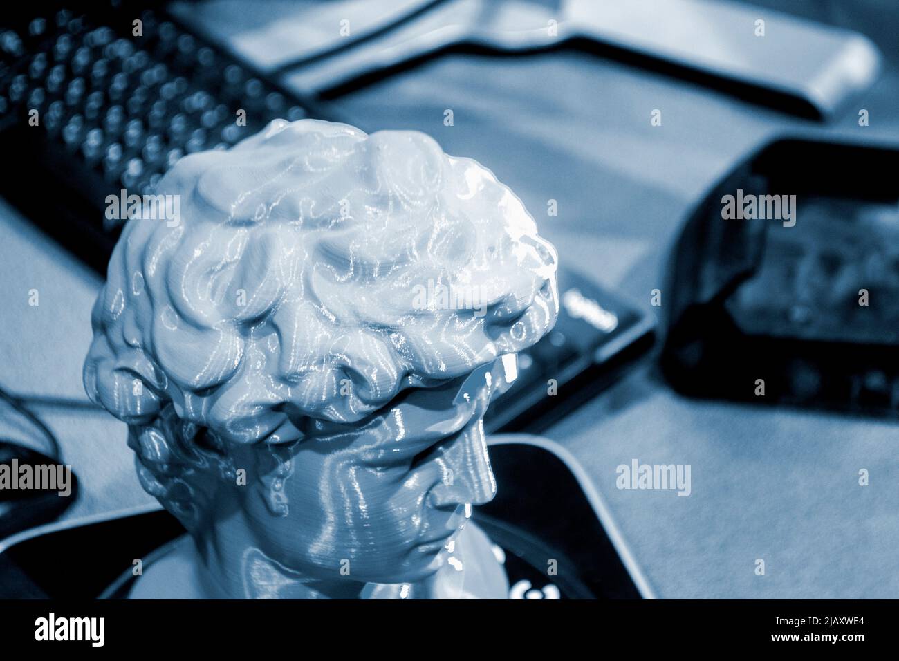 Gray human head on 3d printed close-up. An object prototype of a human ...