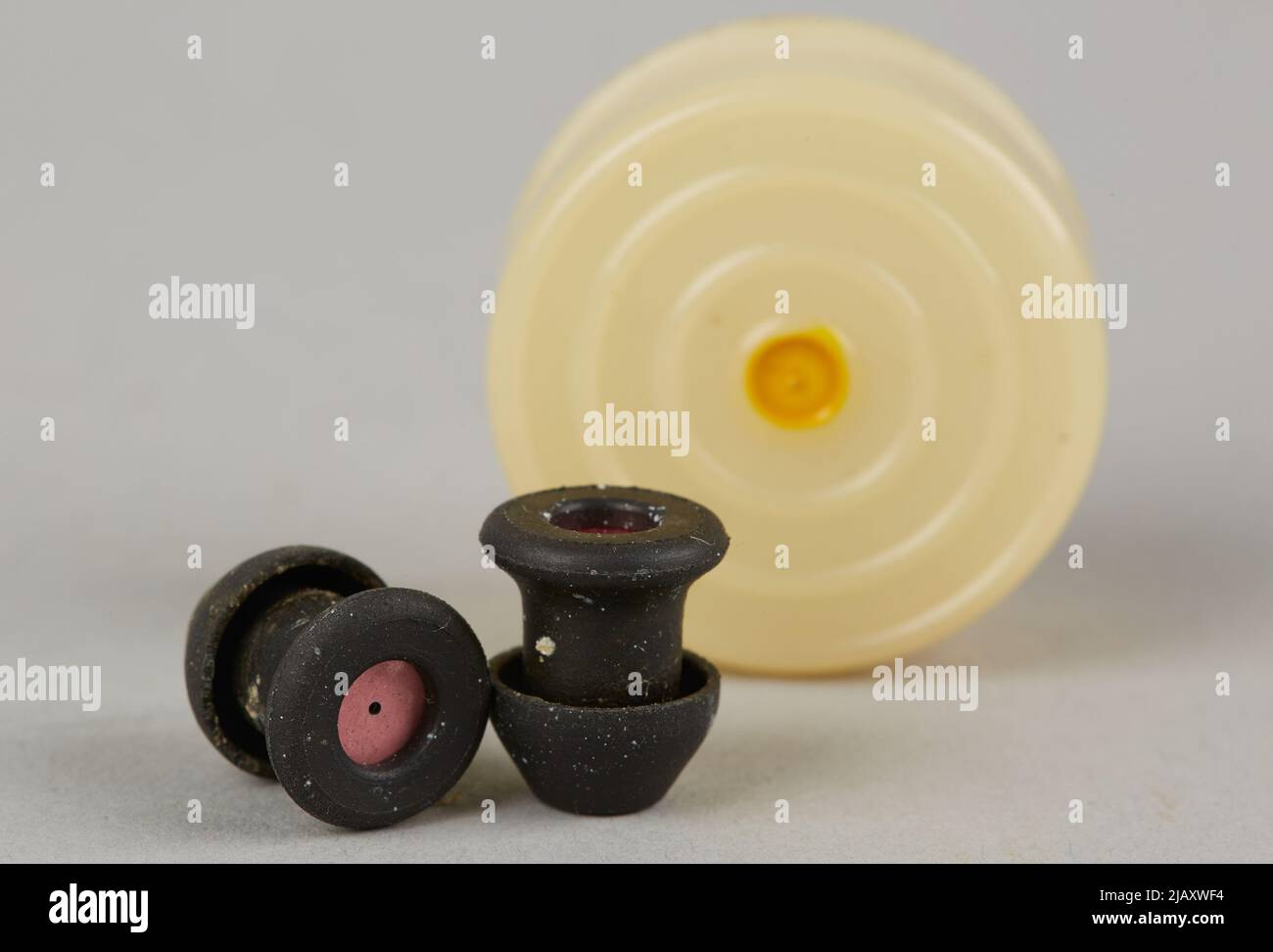 A pair of ear caps used in the Swiss army in the case unknown label ...