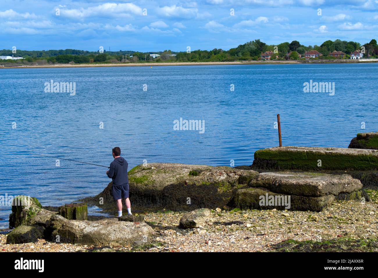 Person fishing by the disused old railway bridge known as the Billy ...