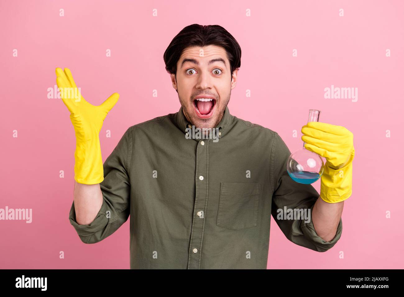 Photo Of Crazy Amazed Scientist Guy Hold Flask Open Mouth Wear Gloves