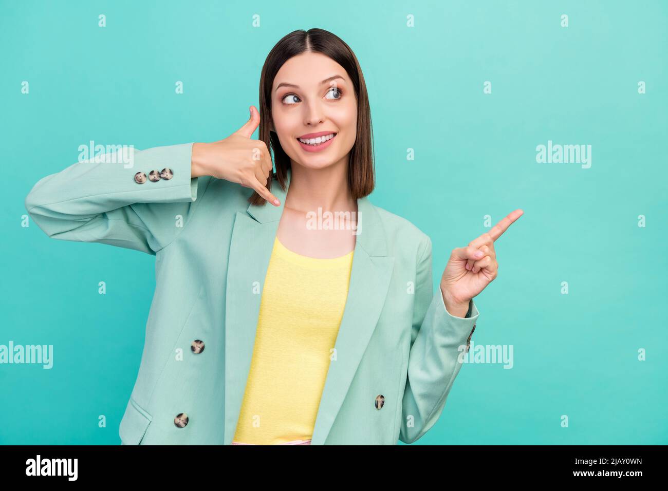Portrait of cheerful attractive lady look indicate finger empty space ...