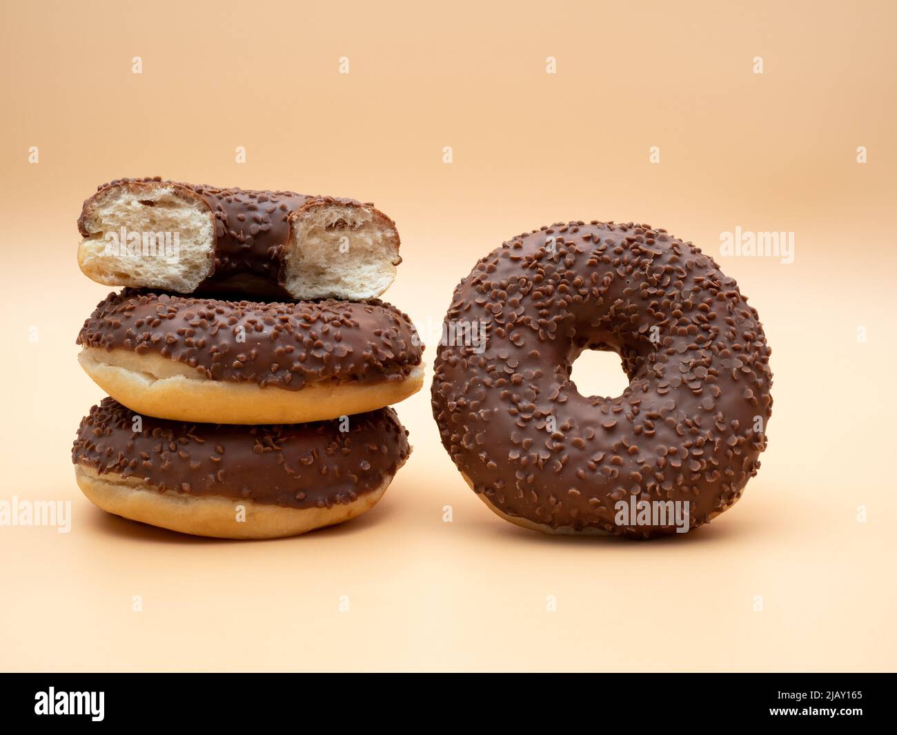 Chocolate donut on a brown background. Donut isolated on brown ...