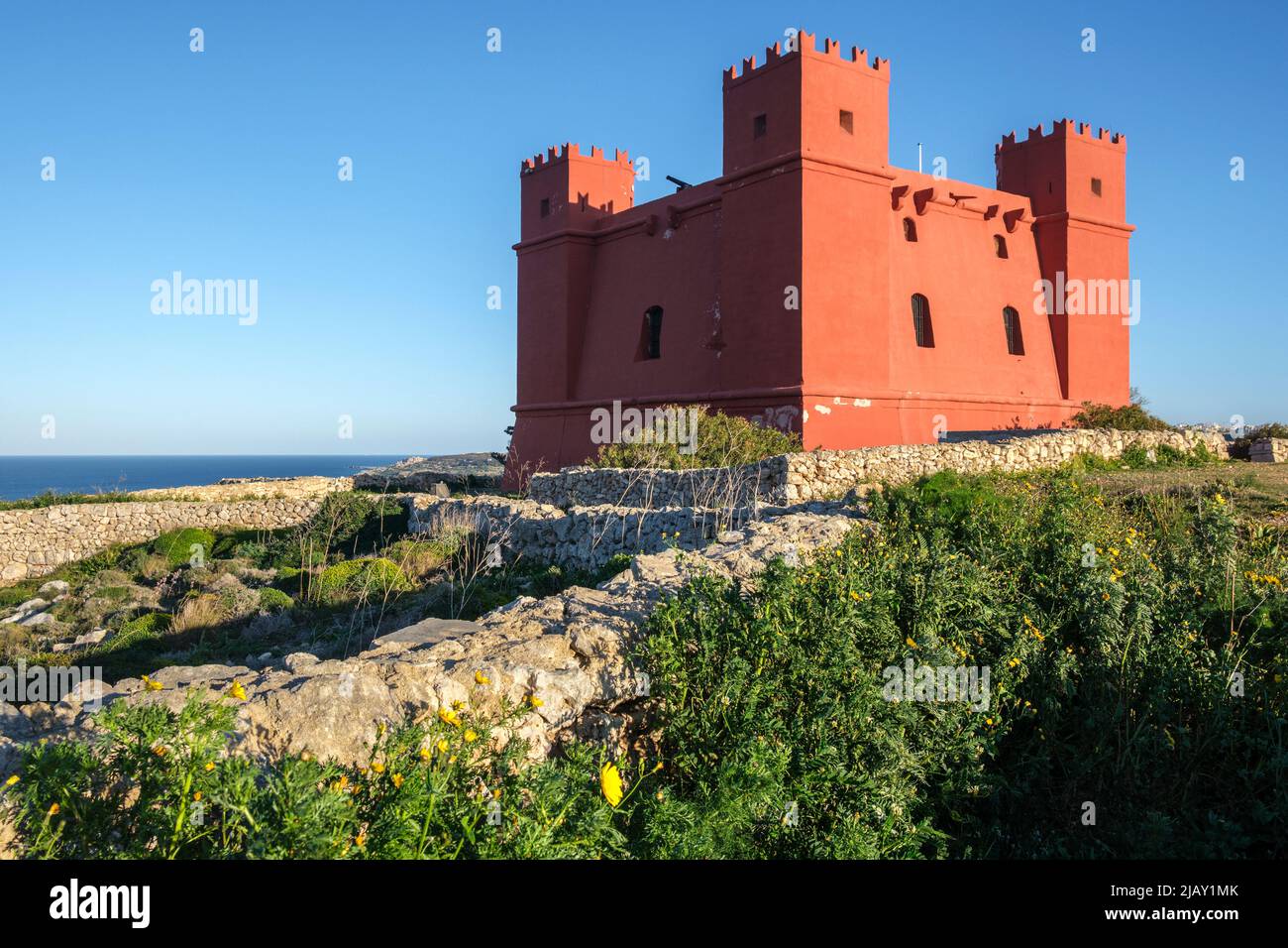 The Red Tower (St Agatha's Tower) in evening sunshine, Mellieha, Malta ...