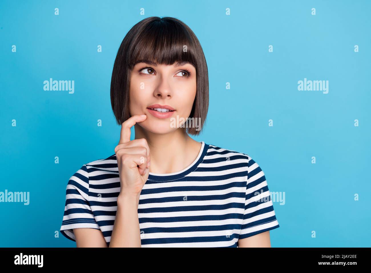 Photo of dreamy minded young charming woman look empty space imagine ...