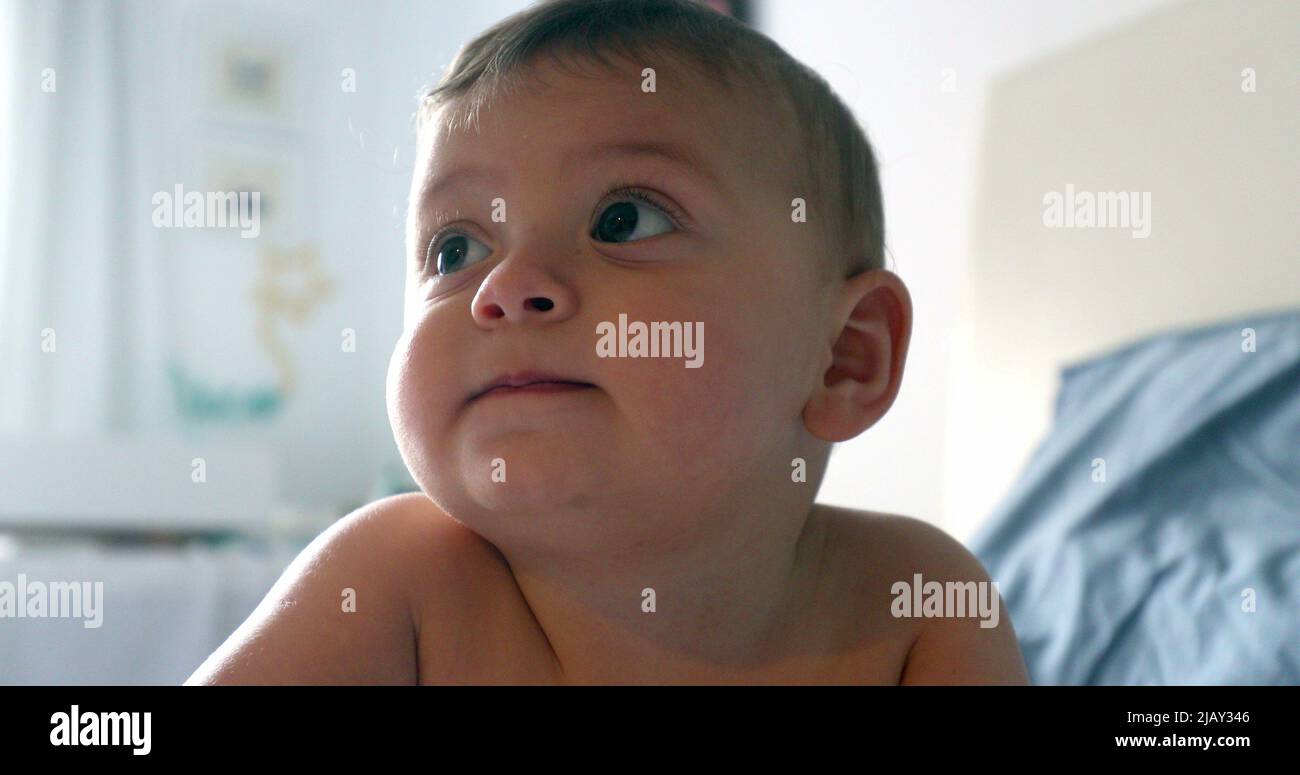 Cute baby portrait lying in bed, adorable infant boy Stock Photo - Alamy