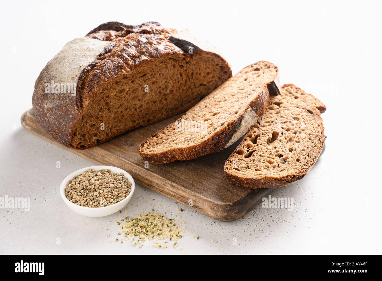 Loaf of Hemp bread, hempseeds and flour isolated on white background ...