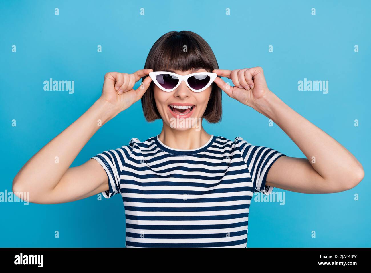 Photo of funny brunette young lady wear spectacles striped t-shirt ...