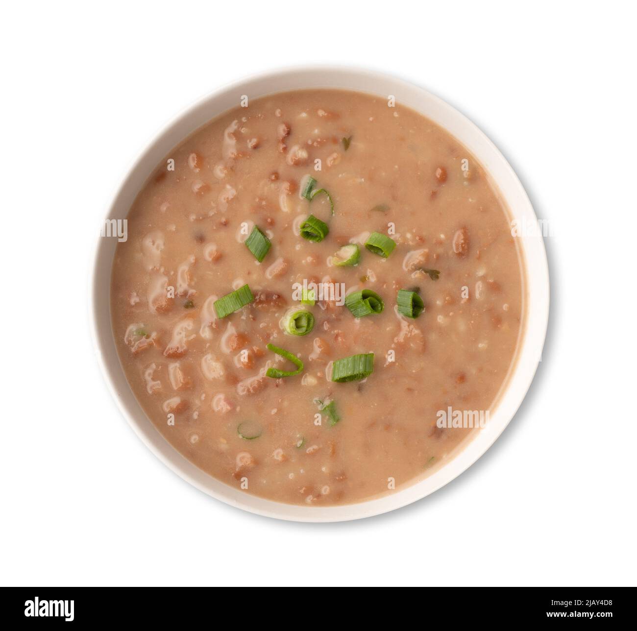 Brown bean soup in a bowl isolated over white background Stock Photo ...