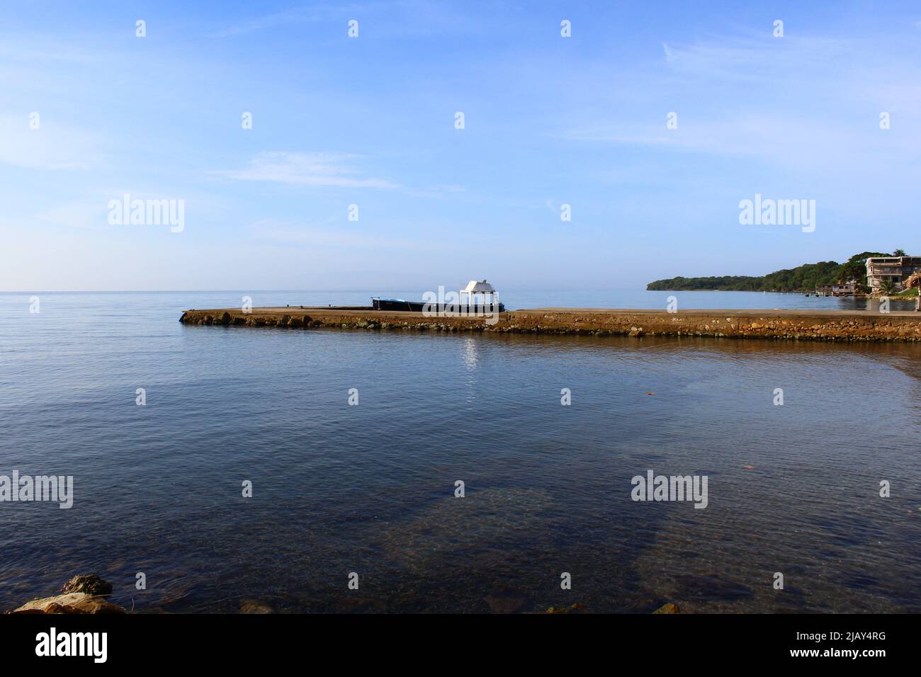 PUNTA GORDA, BELIZE - SEPTEMBER 18, 2015 private cement jetty and cargo ...