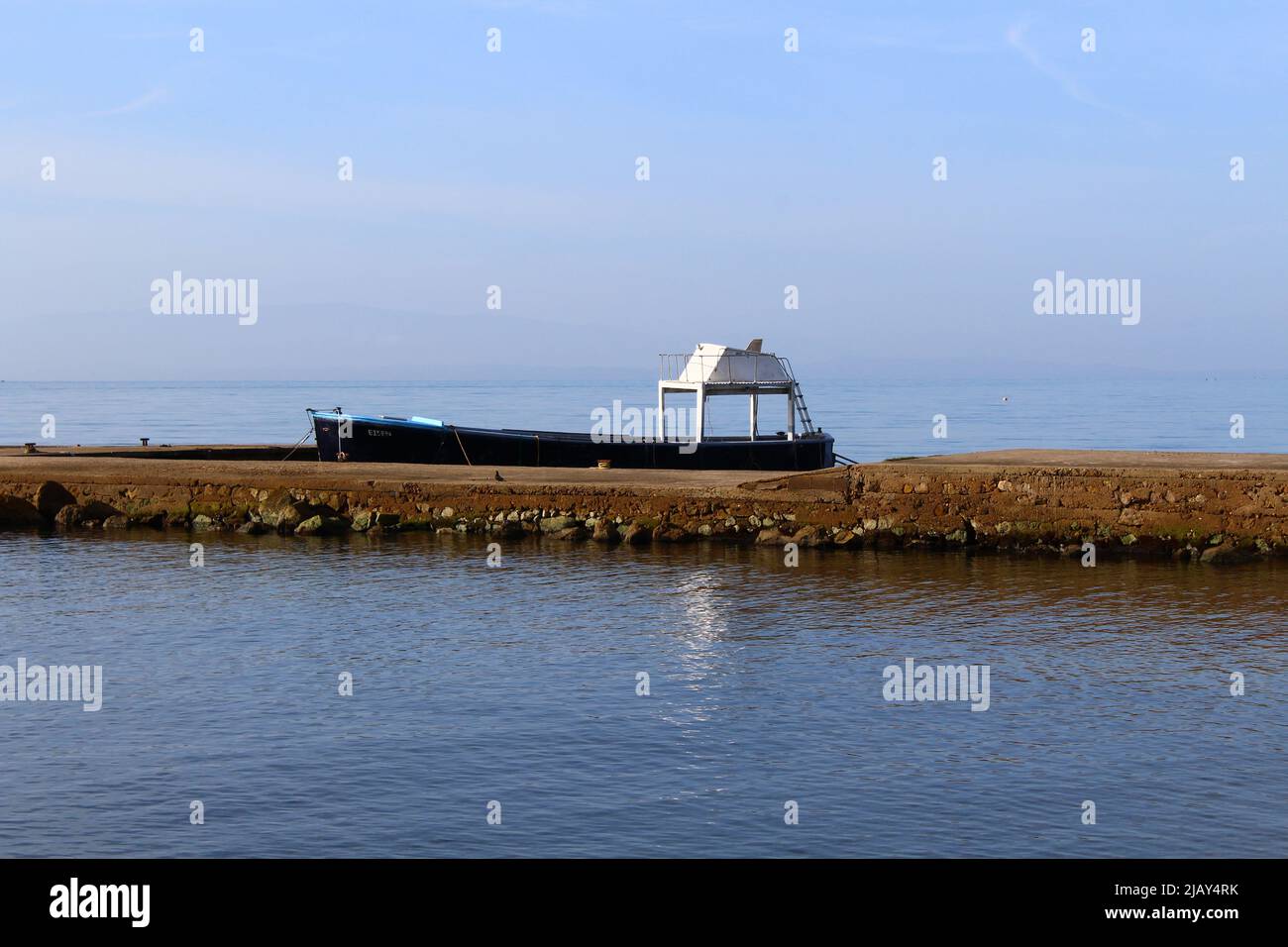 PUNTA GORDA, BELIZE - SEPTEMBER 18, 2015 private cement jetty and cargo ...