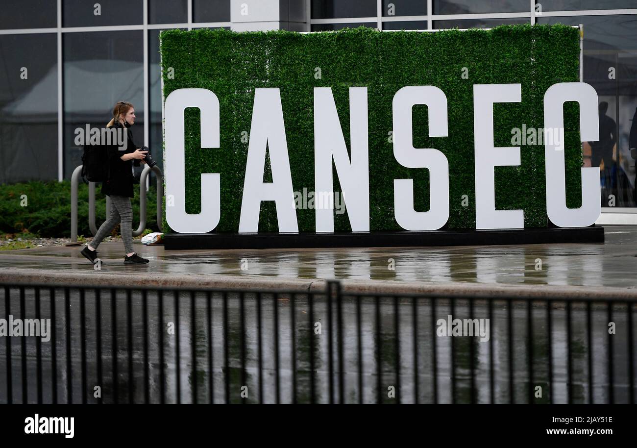 Ottawa, Can. 01st June, 2022. A photographer walks past signage outside ...