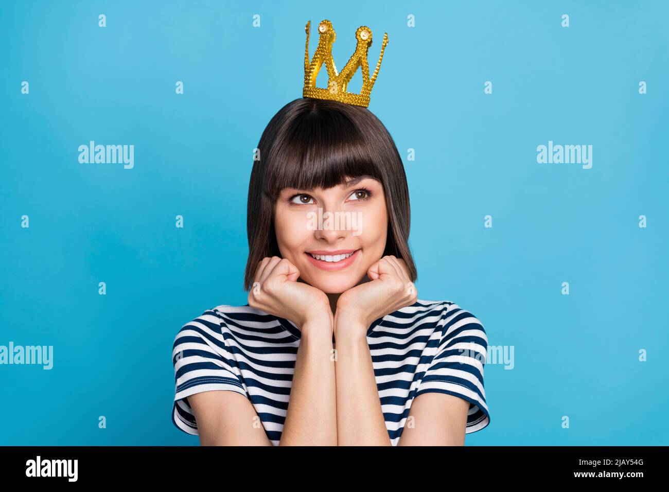 Photo of cute brunette millennial lady hands face look empty space wear ...