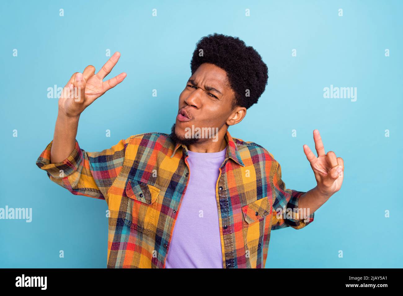 Photo of pretty funky dark skin guy dressed checkered shirt showing v ...