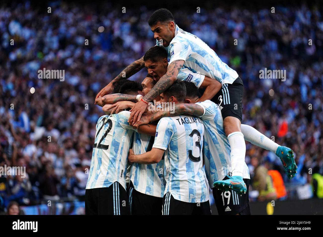 Argentina's Lautaro Martinez is mobbed by team-mates as he celebrates ...