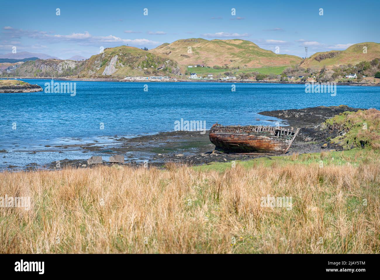 Little Horse Shoe Bay with a wreck boat on the rocky shore, kerrera ...
