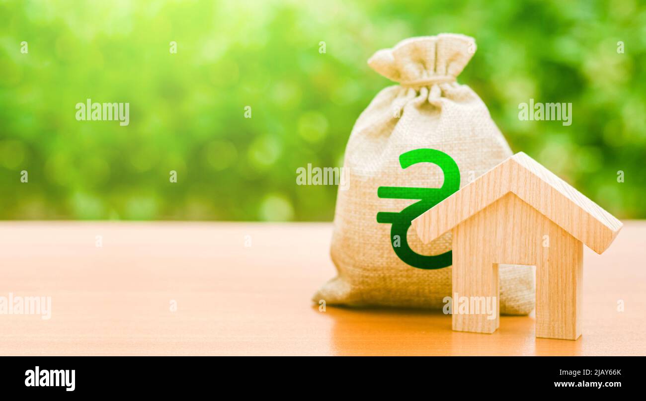 Ukrainian hryvnia money bag and house. Cash compensation for damaged ...