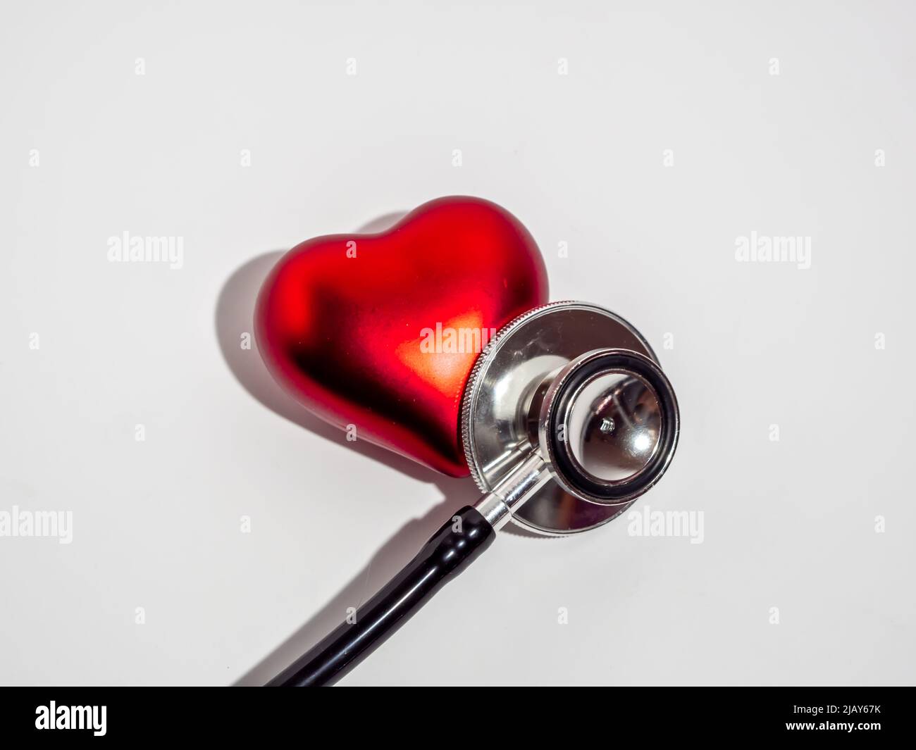 Red heart and stethoscope on a white table. High quality photo Stock ...