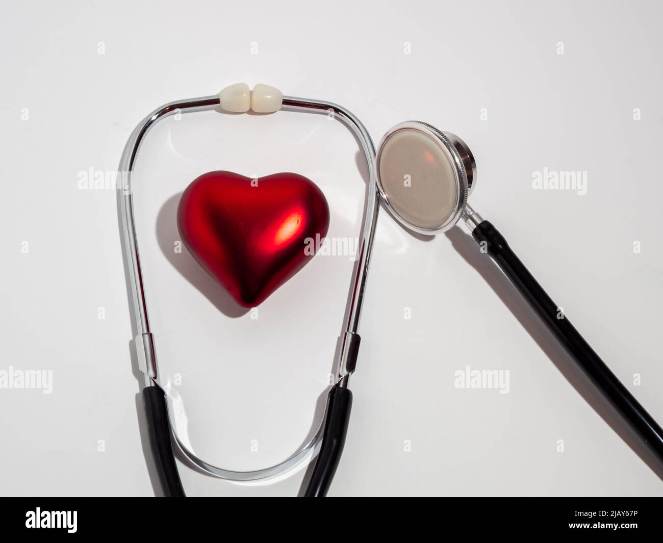 Red heart and stethoscope on a white table. High quality photo Stock ...