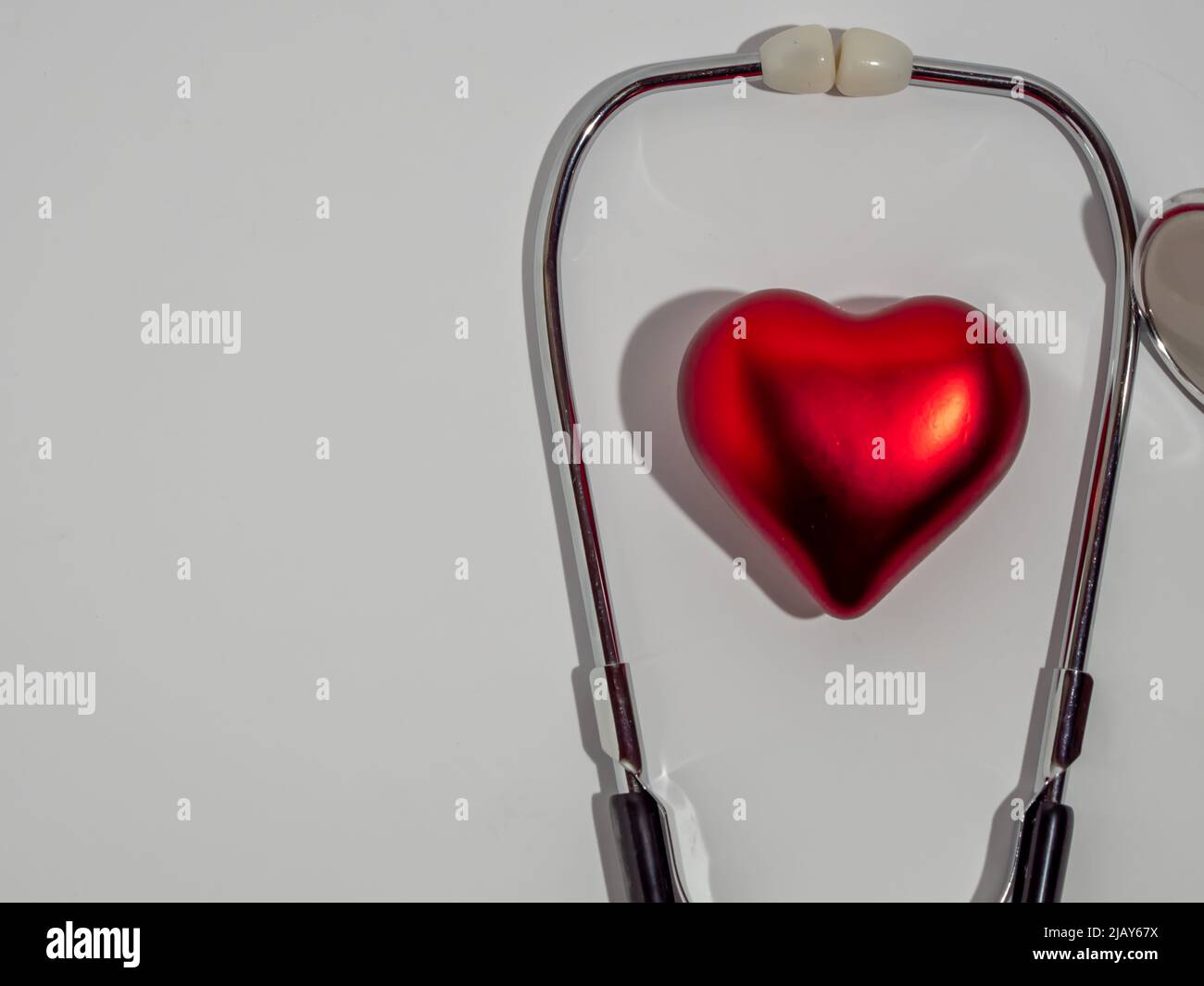 Red heart and stethoscope on a white table. High quality photo Stock ...