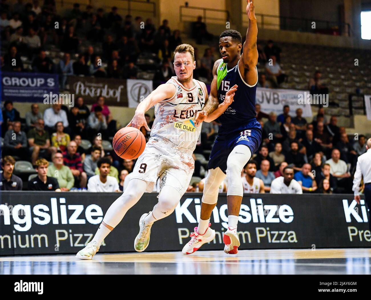 Leuven's Jakob Cebasek and Leiden's Peter Olisemeka pictured in action ...