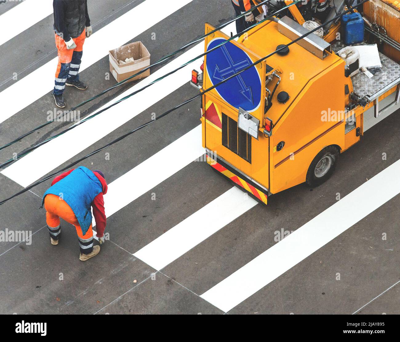 line marking AI robotic big machine, painting a zebra marking on a ...