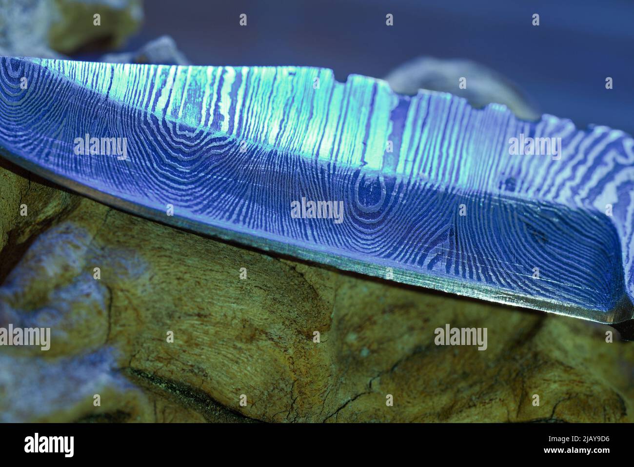 Hand-forged knife made of several layers of steel with an exclusive ...