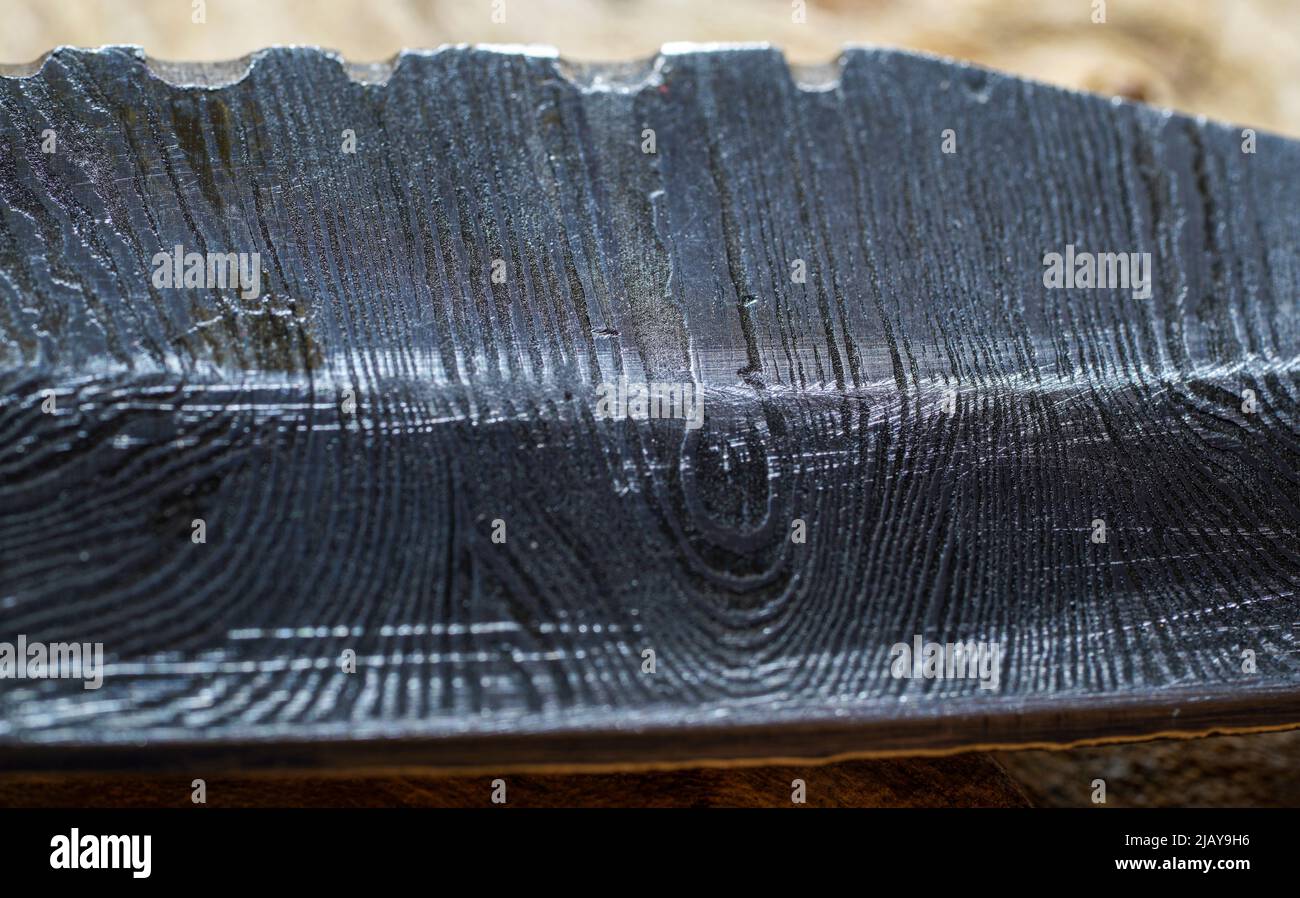 Hand-forged knife made of several layers of steel with an exclusive ...